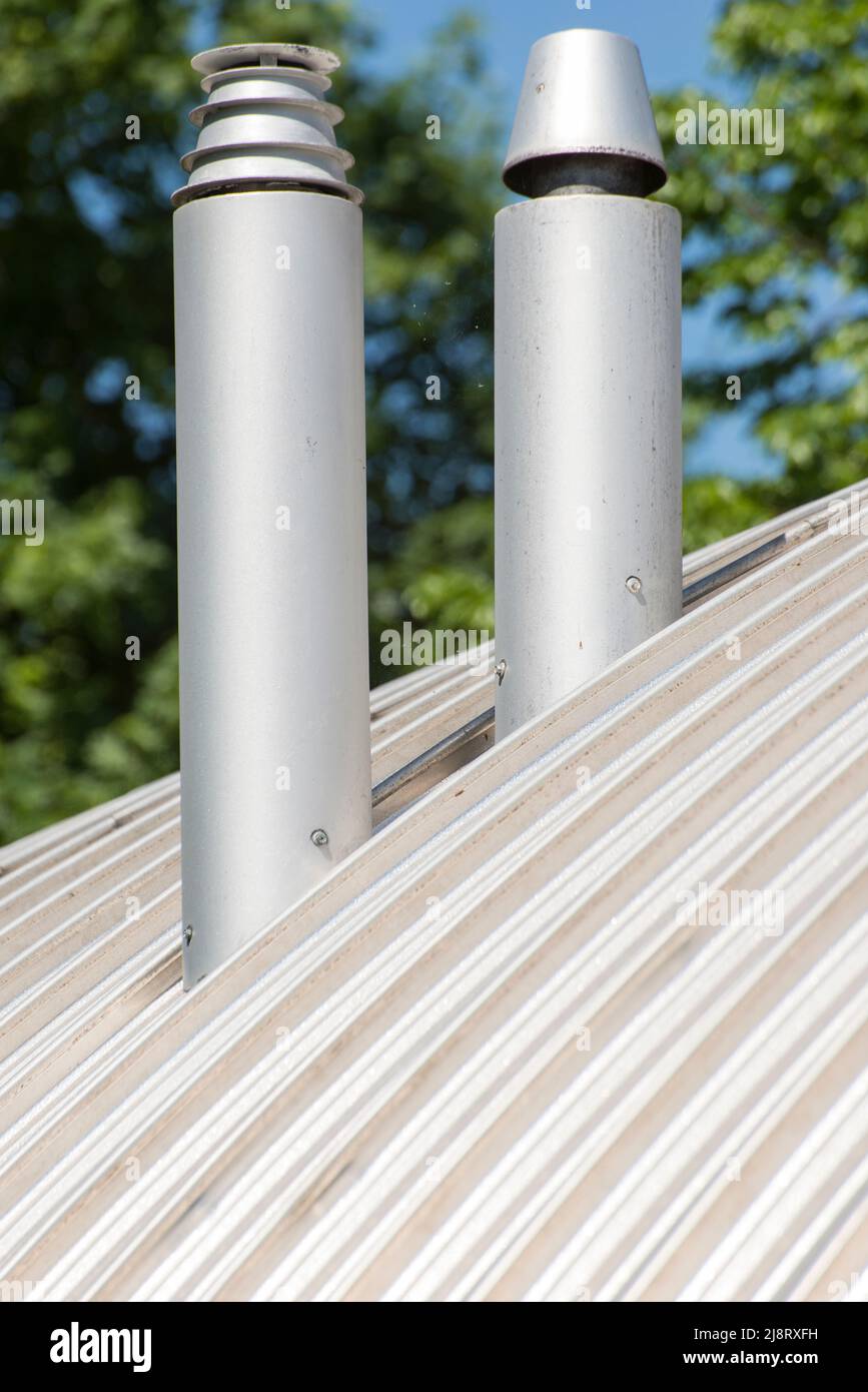 Round metal chimneys Stock Photo - Alamy