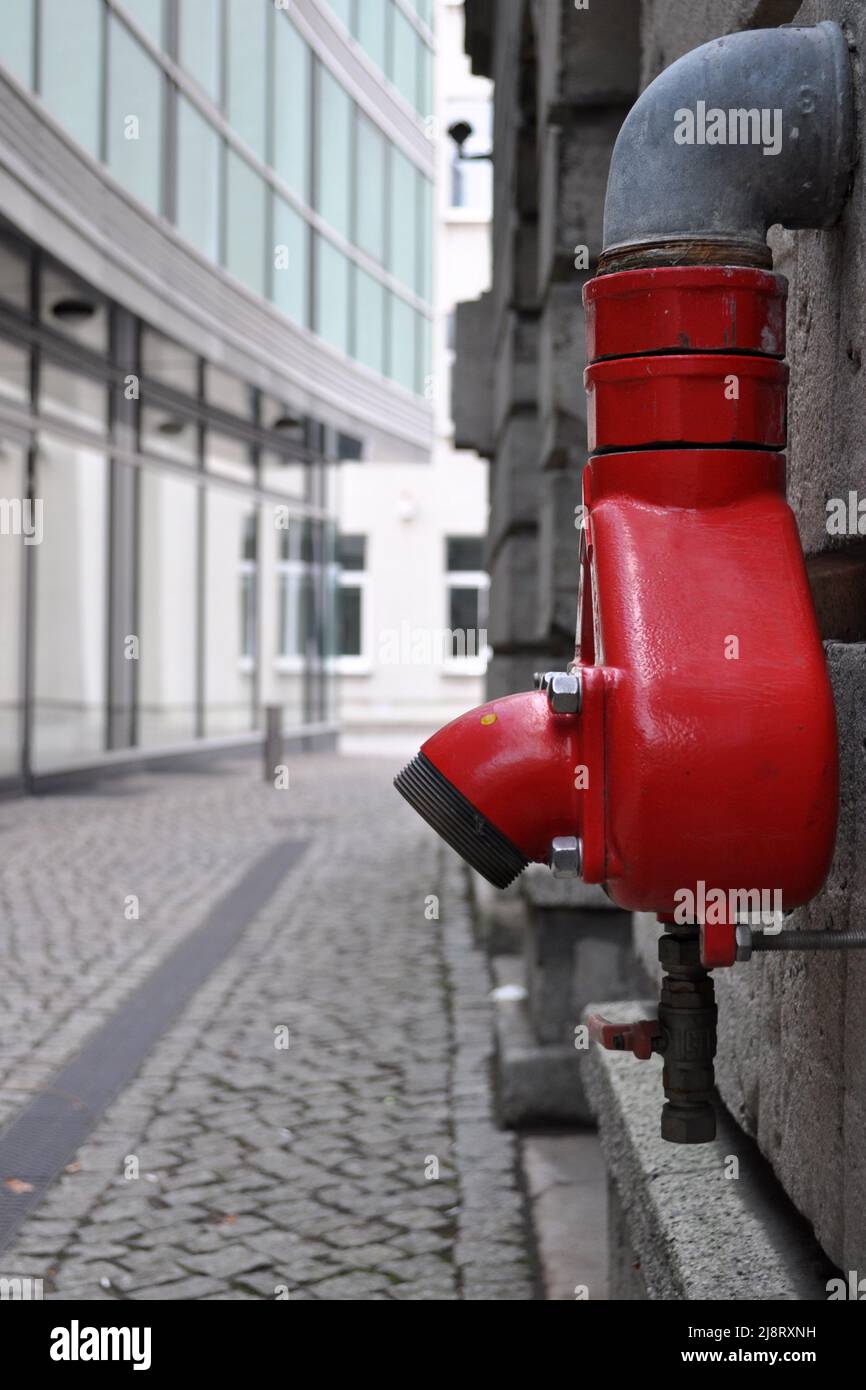 Red water hydrant in a modern city Stock Photo - Alamy