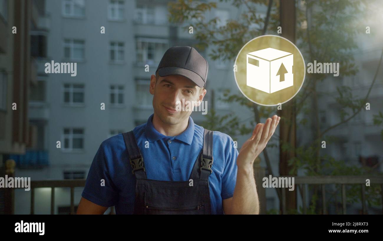 Happy young delivery courier in blue cap showing box icon with hand ...