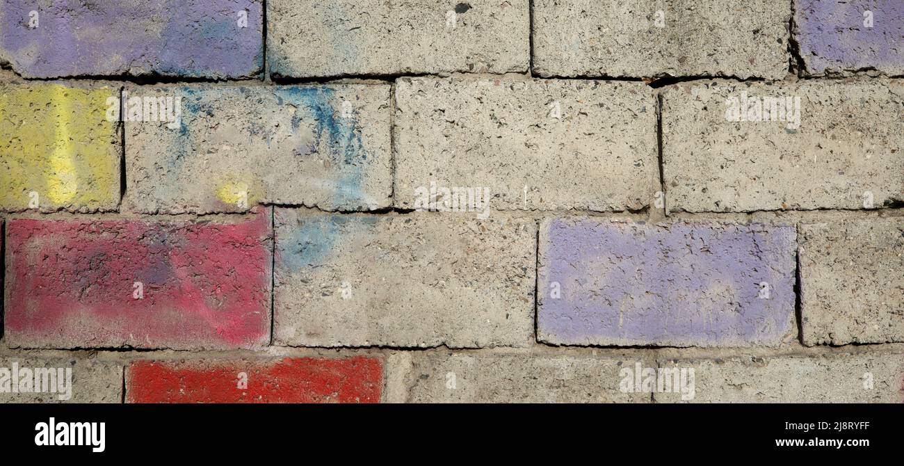 Colorful paint peeling on stone wall Stock Photo - Alamy