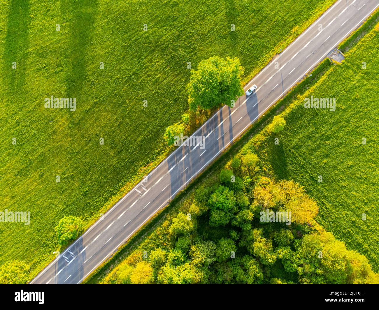 Straight asphalt road from above Stock Photo - Alamy