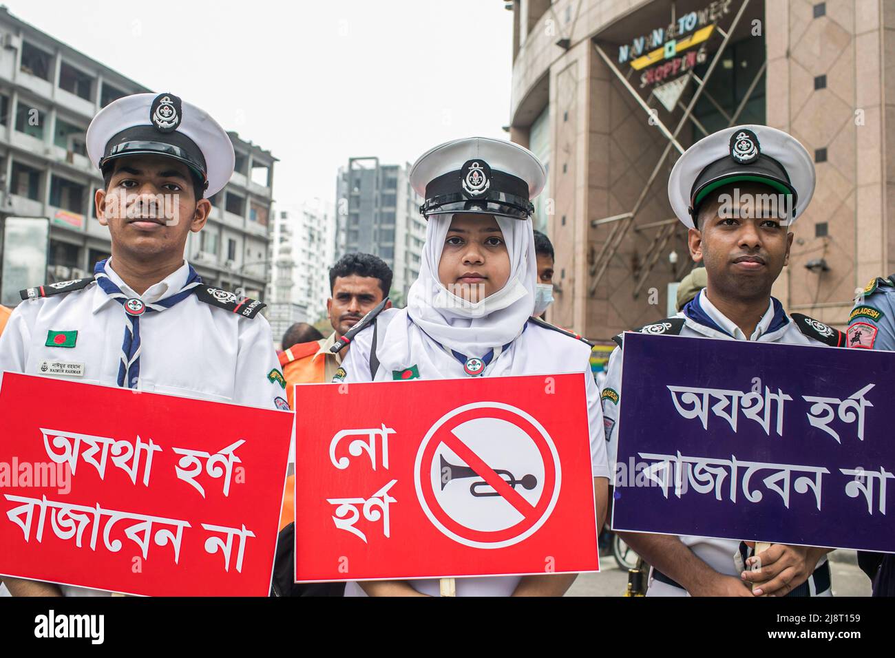Rover Scout members hold placards during the No Horn campaign in Dhaka ...