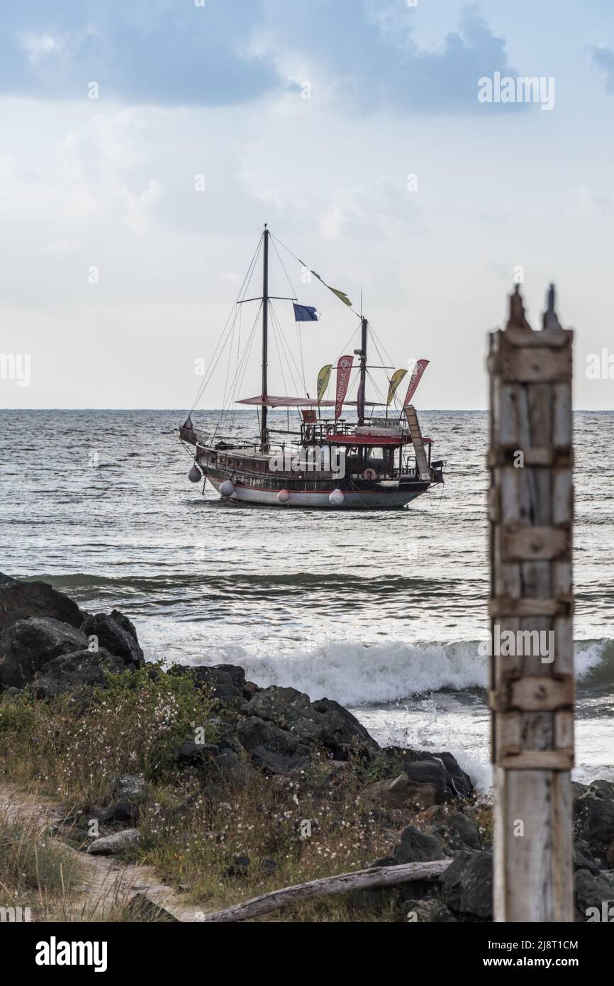 Small ship sailing in waters Stock Photo - Alamy