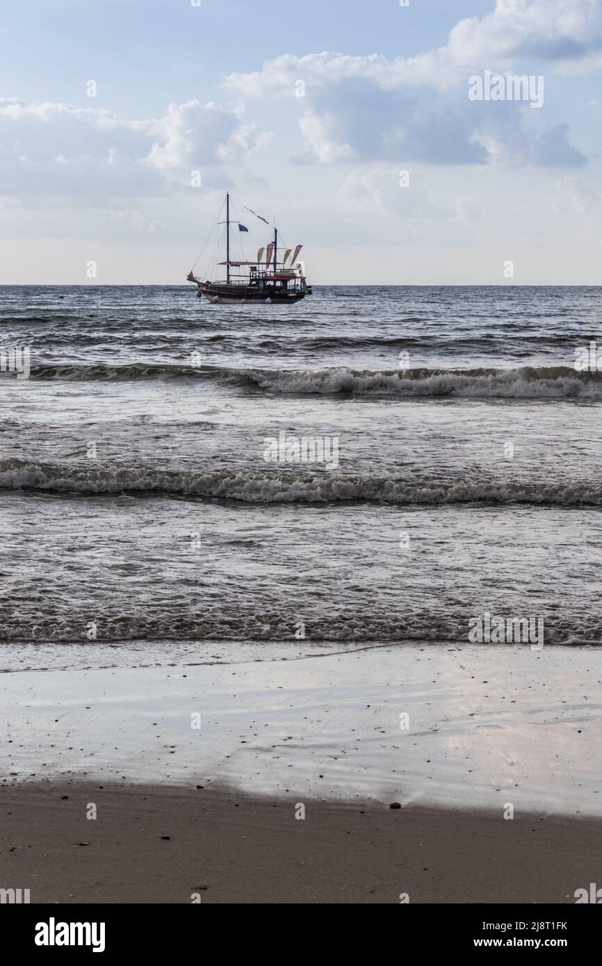 Small ship sailing in waters Stock Photo - Alamy
