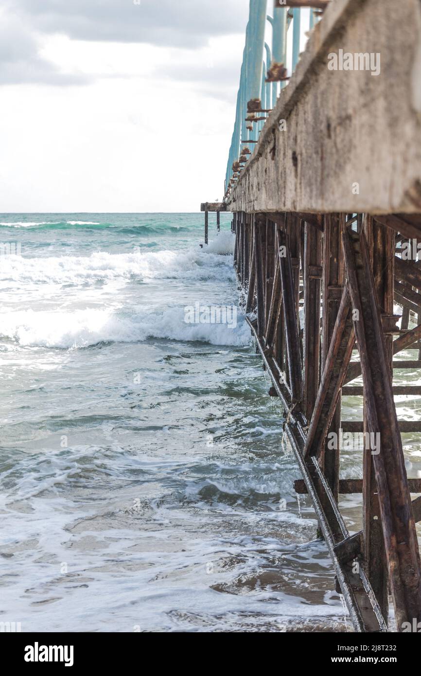Old, abandoned jetty rotting away over the sea Stock Photo - Alamy