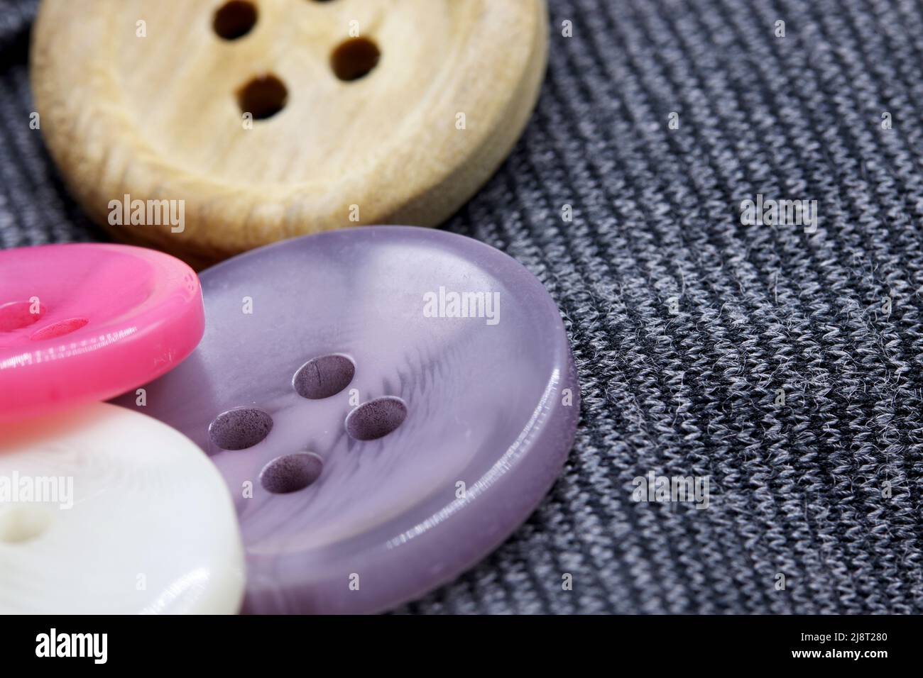 Colored buttons on fabric background Stock Photo - Alamy