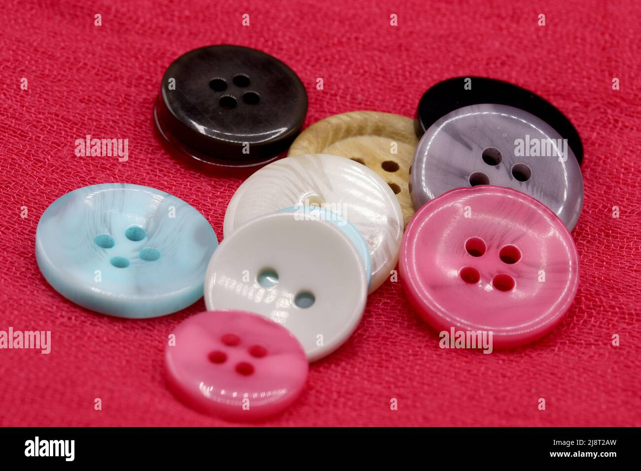 Colored buttons on fabric background Stock Photo - Alamy