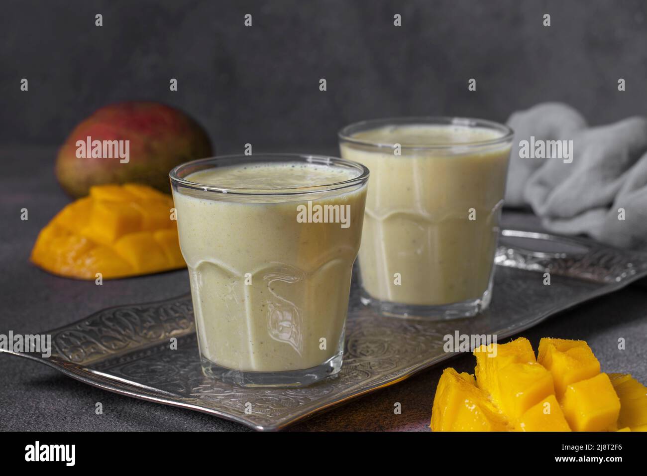 Mango lassi in two glasses on gray background. Freshness indian lassi ...