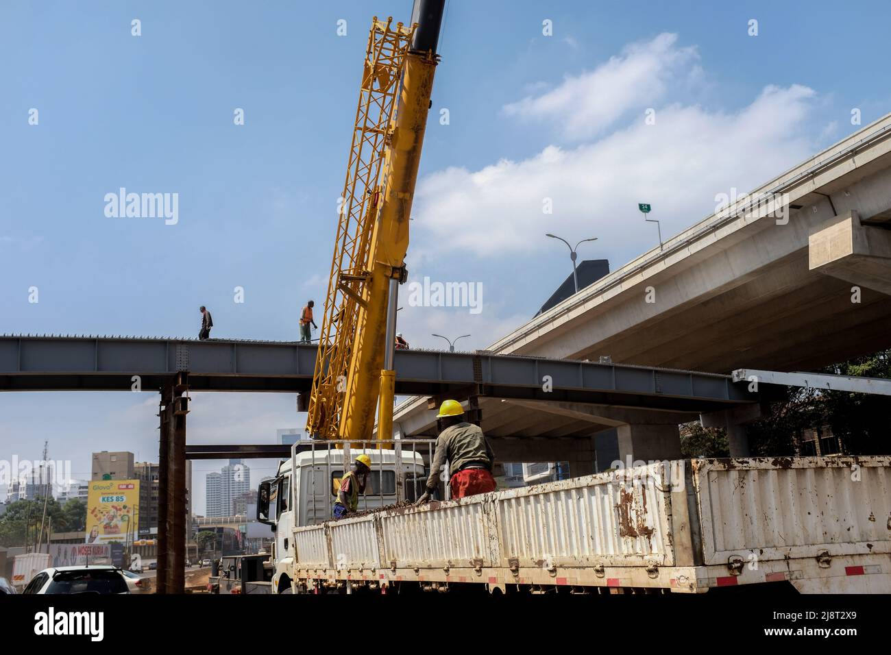 Construction workers put progress to the new Nairobi Expressway. On ...
