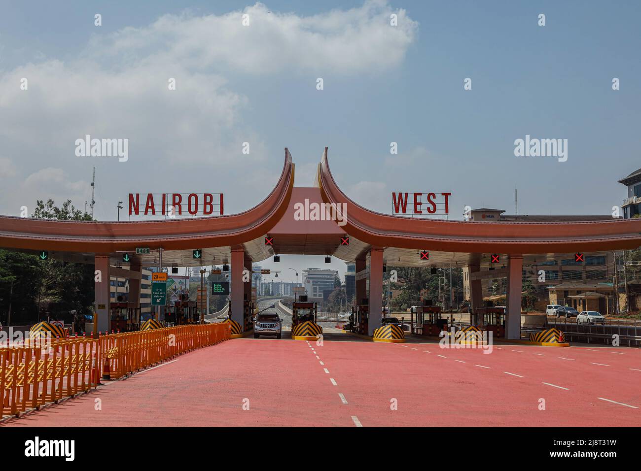 Motorists drive through a Nairobi Expressway toll station in Westlands ...