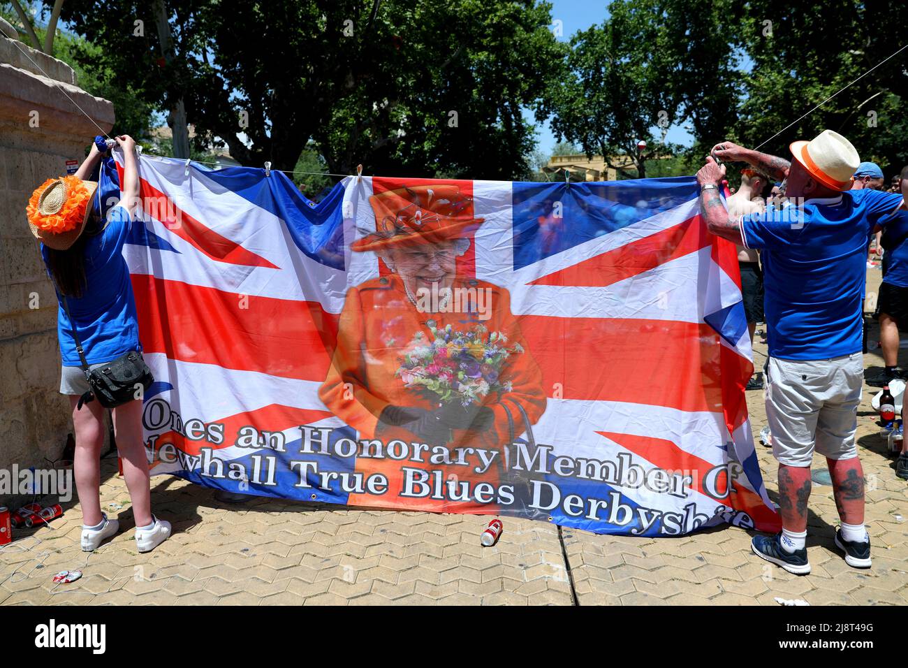 Rangers fans hang up a banner of Queen Elizabeth II at the Alameda de ...