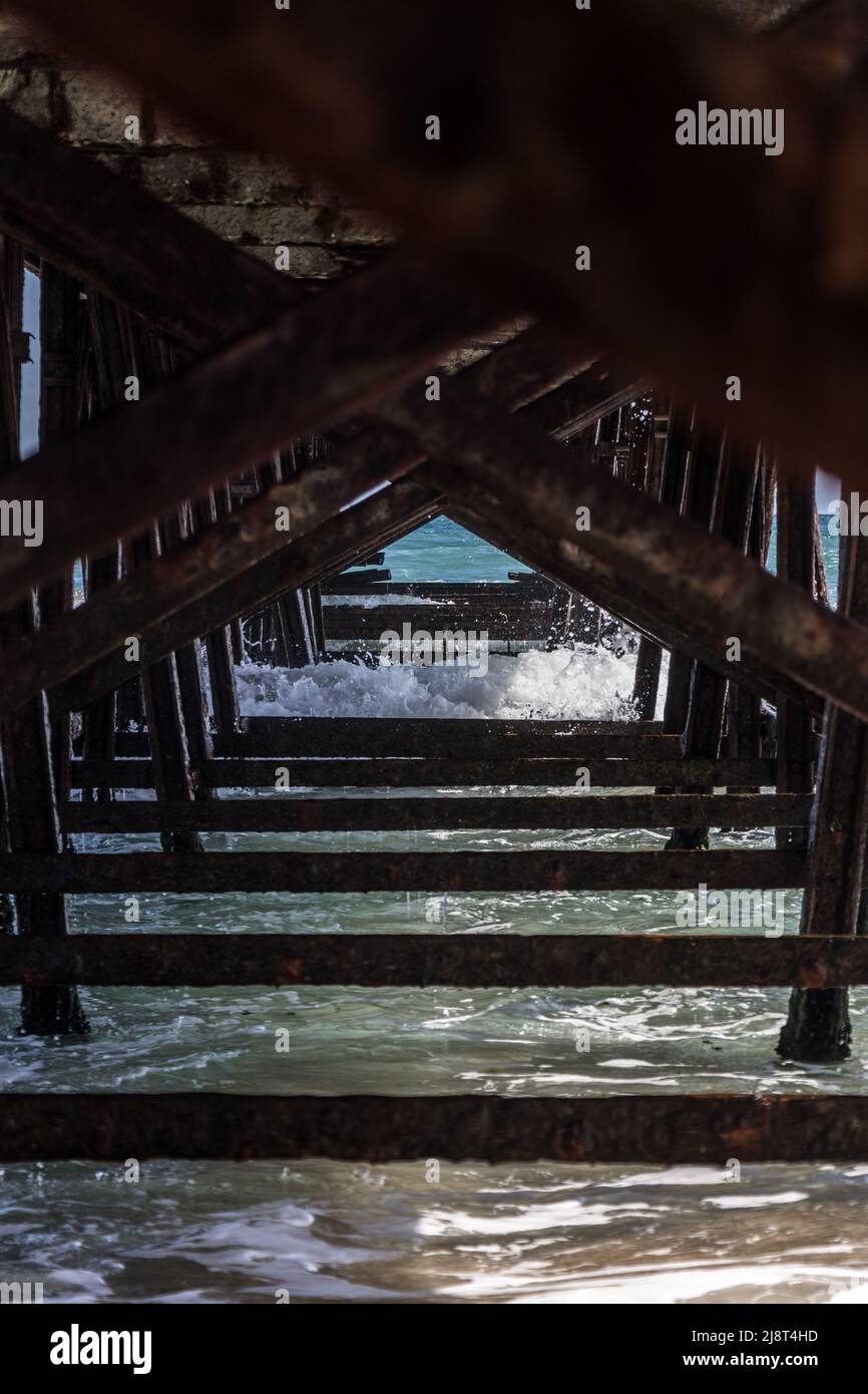 Old, abandoned jetty rotting away over the sea Stock Photo - Alamy