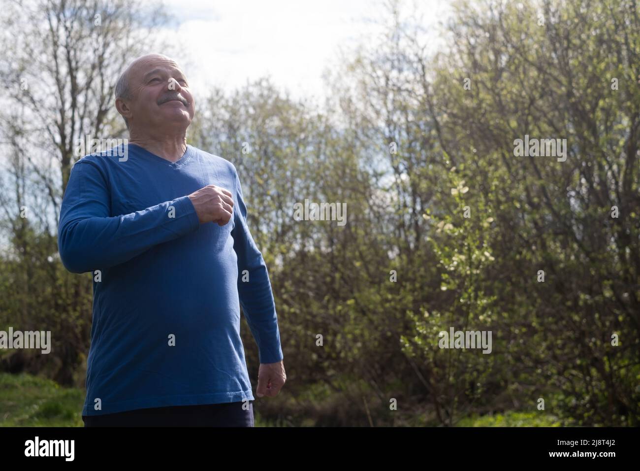 Active senior man is jogging breathing fresh air. Healthy retirement ...