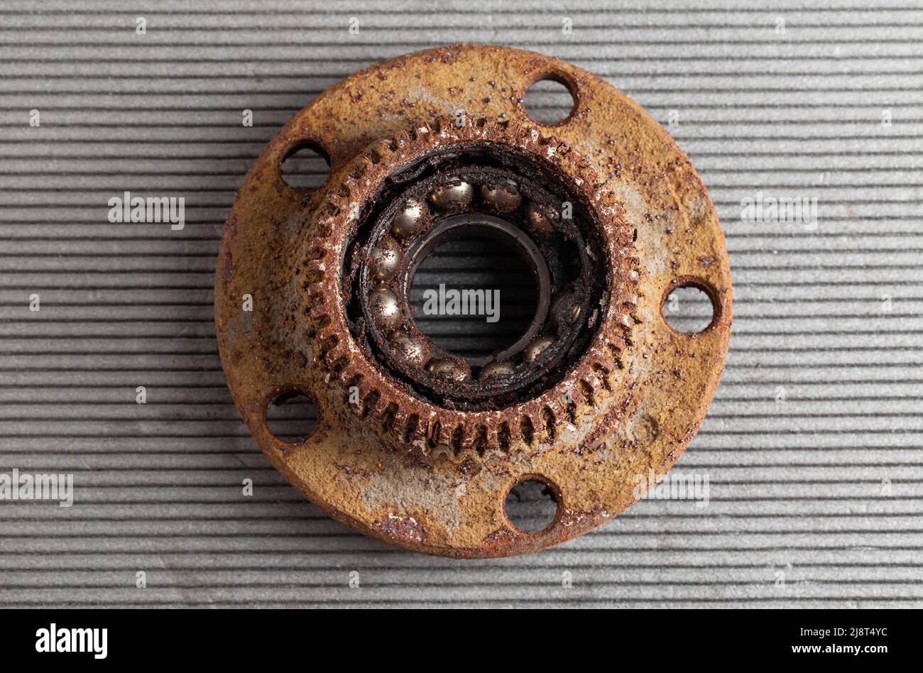 Old rusty wheel hub with a broken bearing. Bearing jamming. Automotive ...