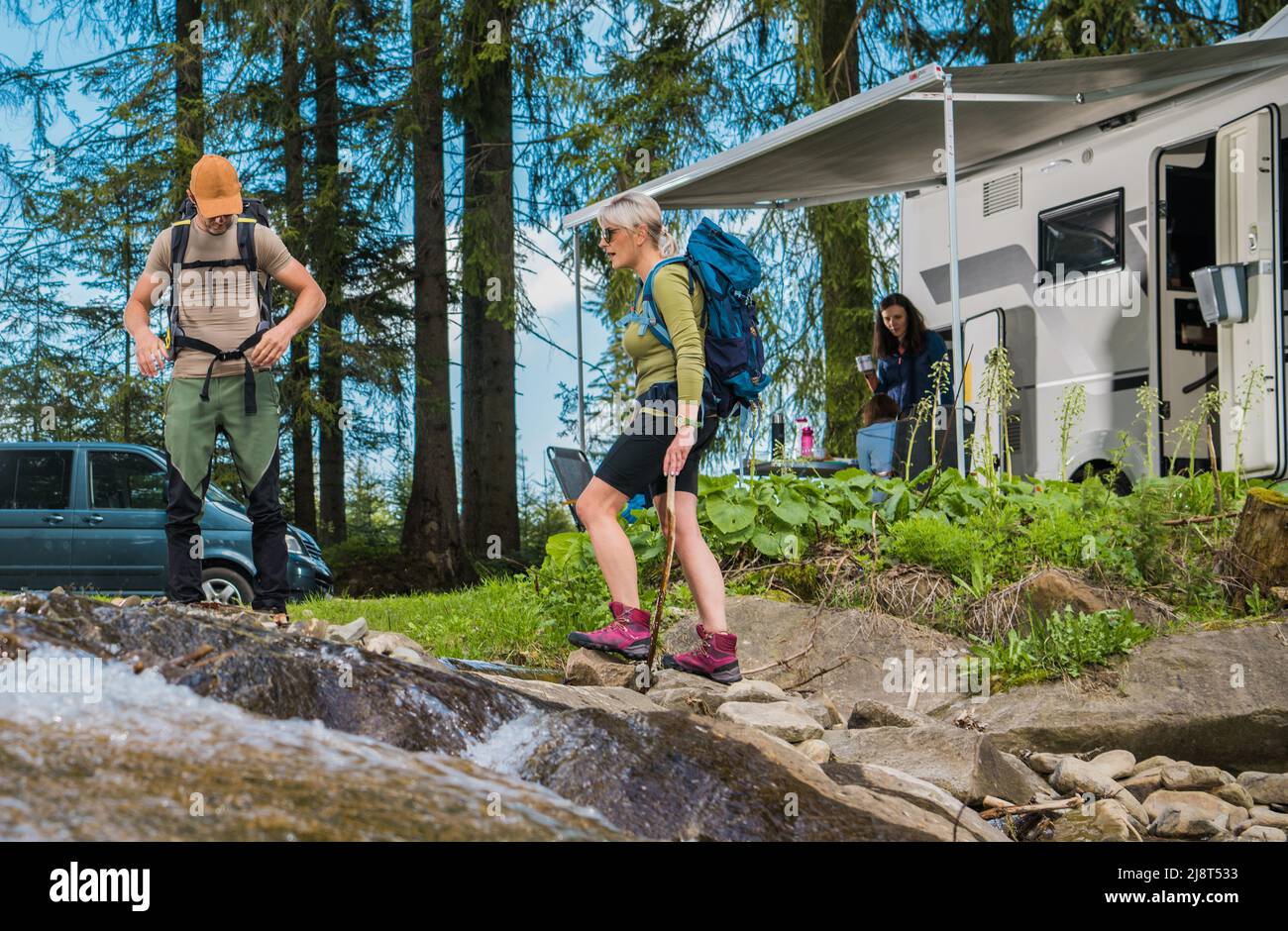 Caucasian Backpackers Ready For a Hike RV Camping Theme. Camper Van in ...