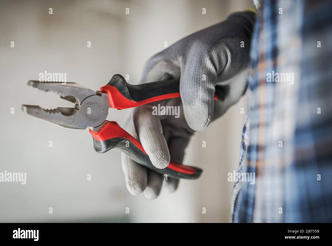 Construction Worker with Pliers in His Hand Close Up Industrial Theme ...