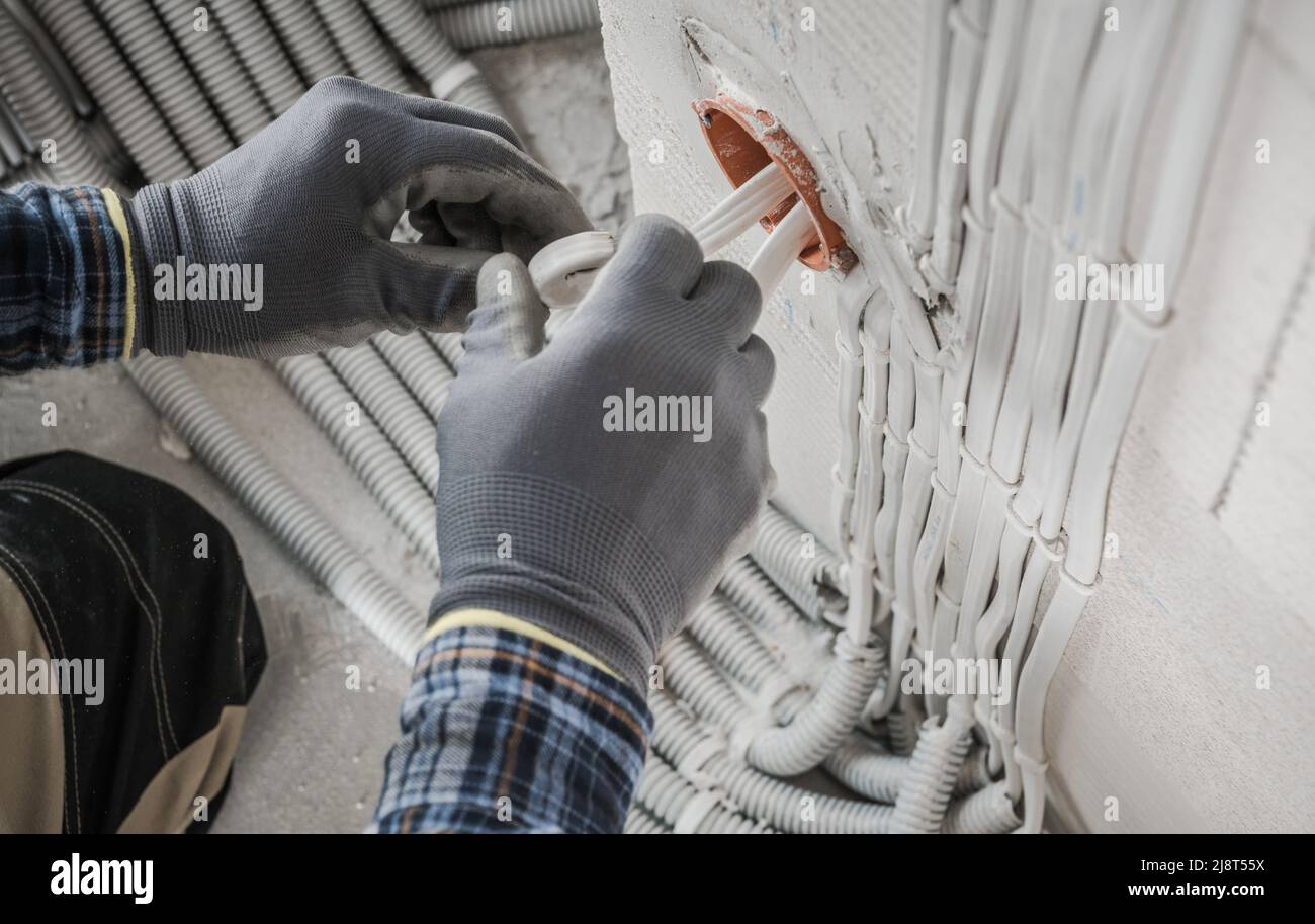 Electrician Installing Electric System Inside a Newly Built Blocks Made ...