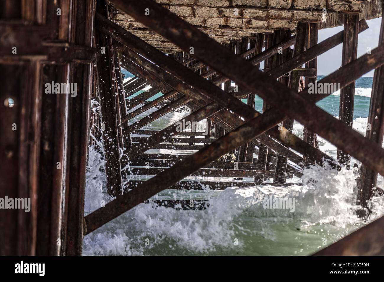 Old, abandoned jetty rotting away over the sea Stock Photo - Alamy