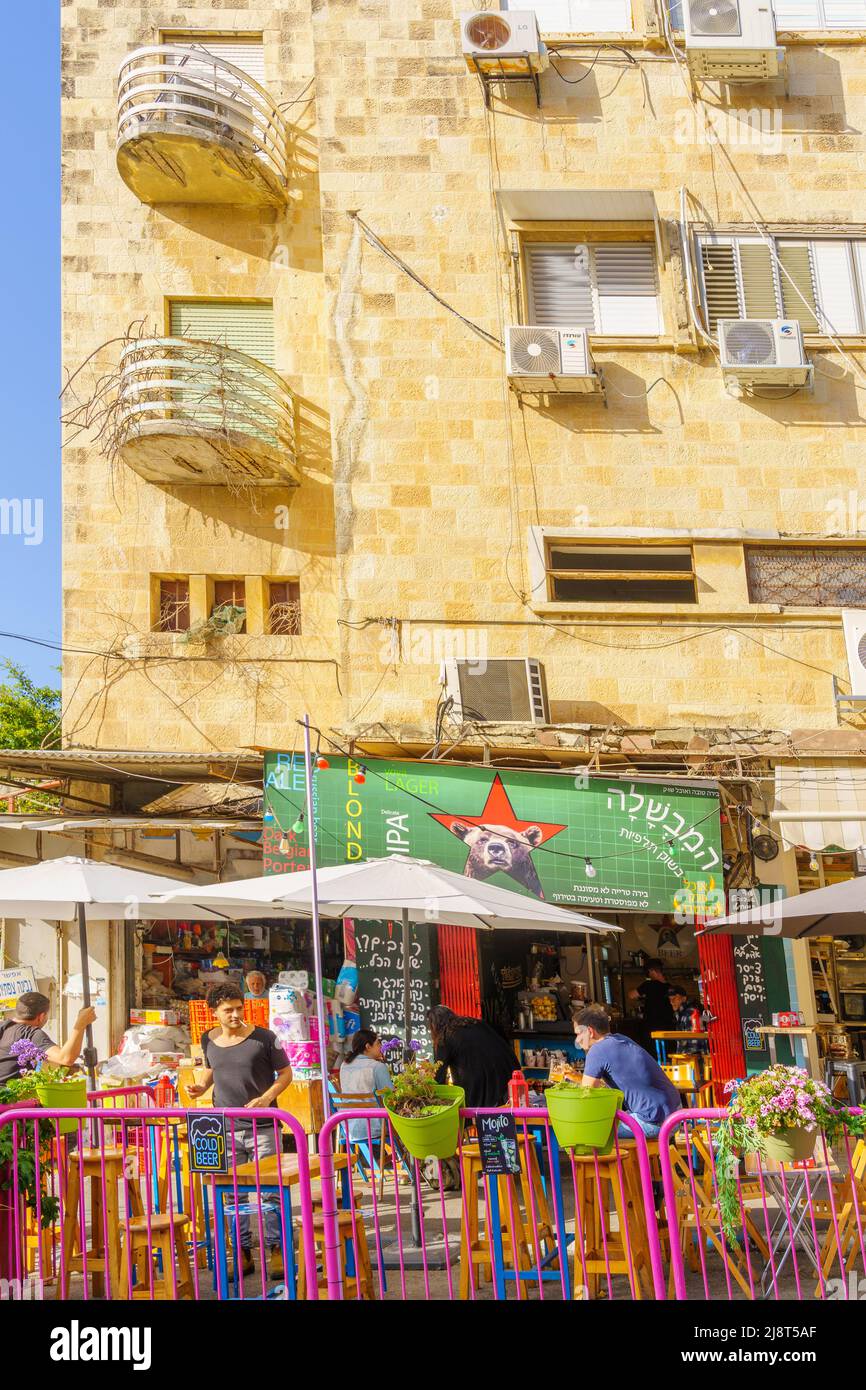 Haifa, Israel - May 12, 2022: Restaurants scene in Talpiot Market, with ...