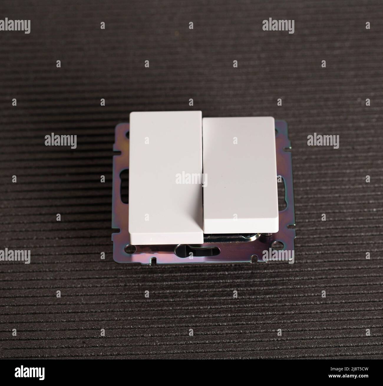 Modern two-gang switch on a gray background, close-up Stock Photo - Alamy