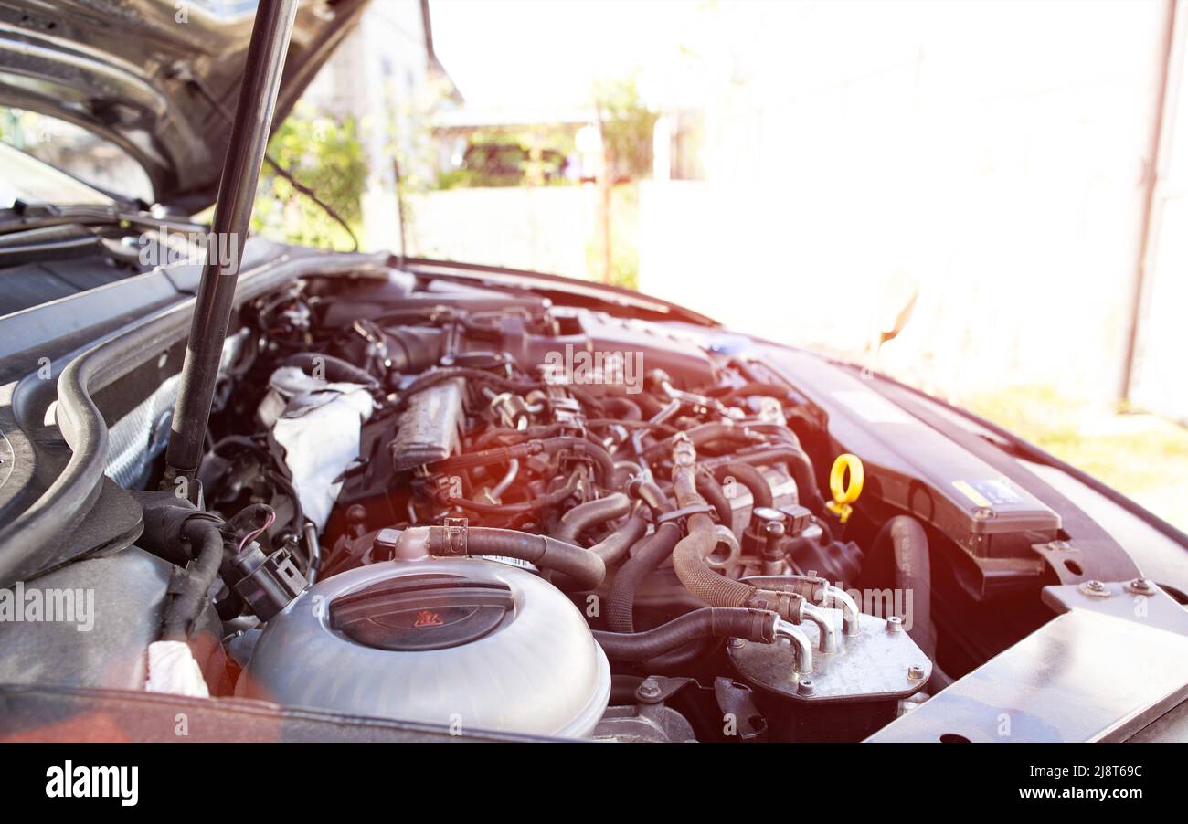 Modern diesel engine on a car with an open hood. Copy space for text ...