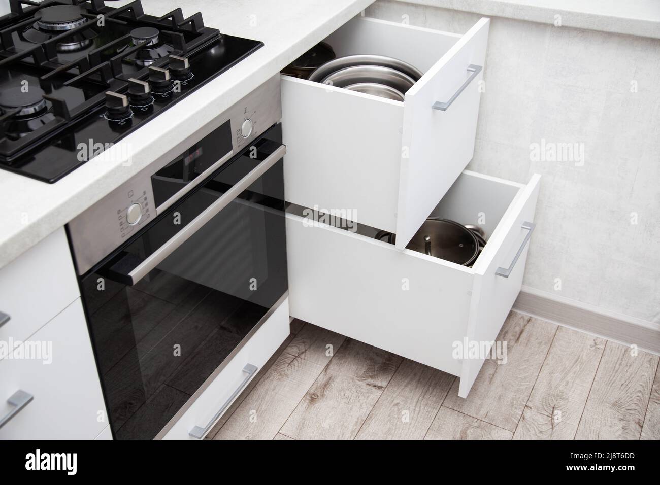 Modern sliding drawer system in the kitchen. Production of kitchen ...