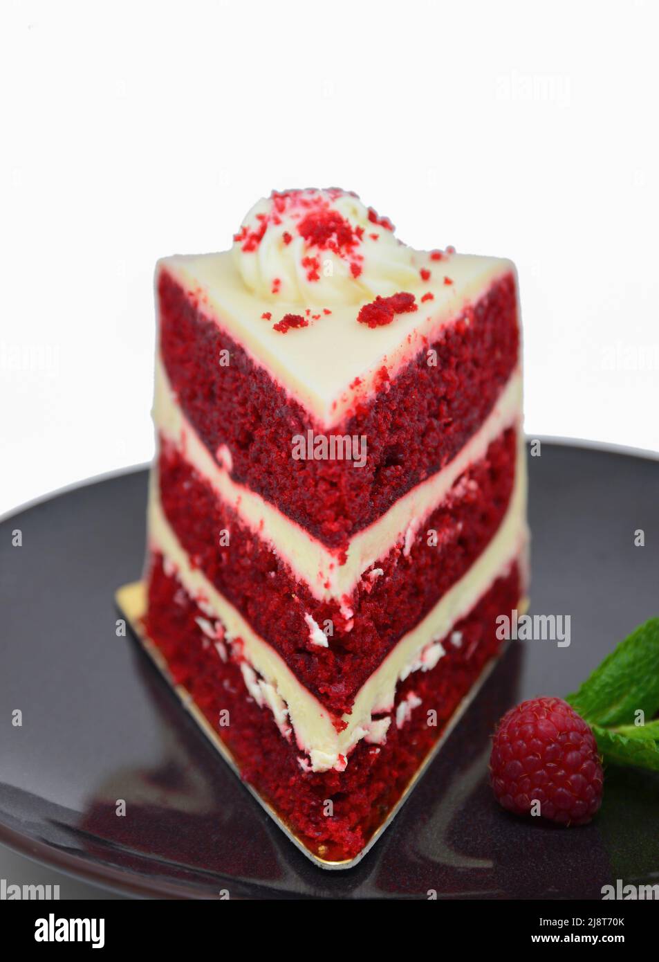 A slice of raspberry cake on white plate against white background Stock ...