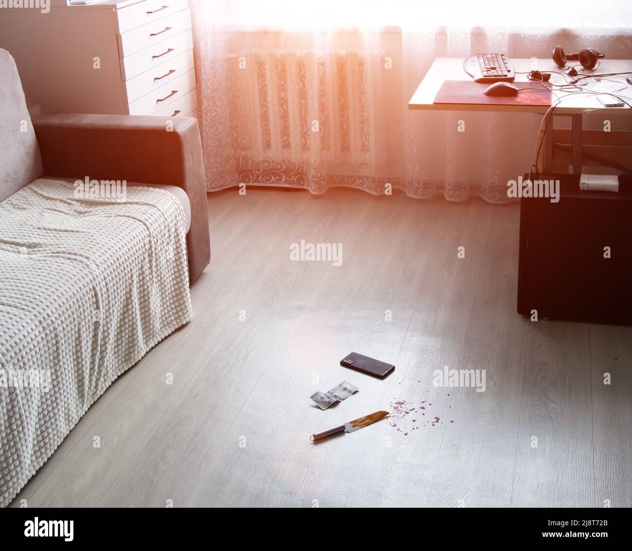 The scene of the crime in the room of the apartment. Knife in blood ...