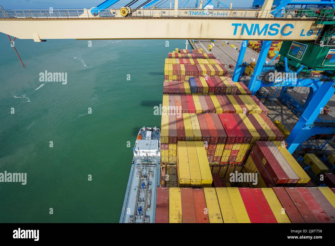 General view of container ship unloading under giant gantries at a ...