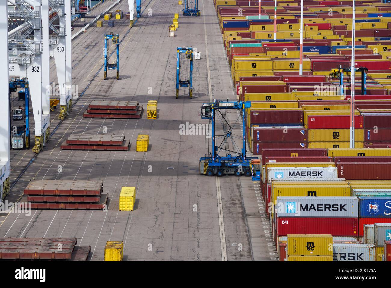 General view of container ship unloading under giant gantries at a ...