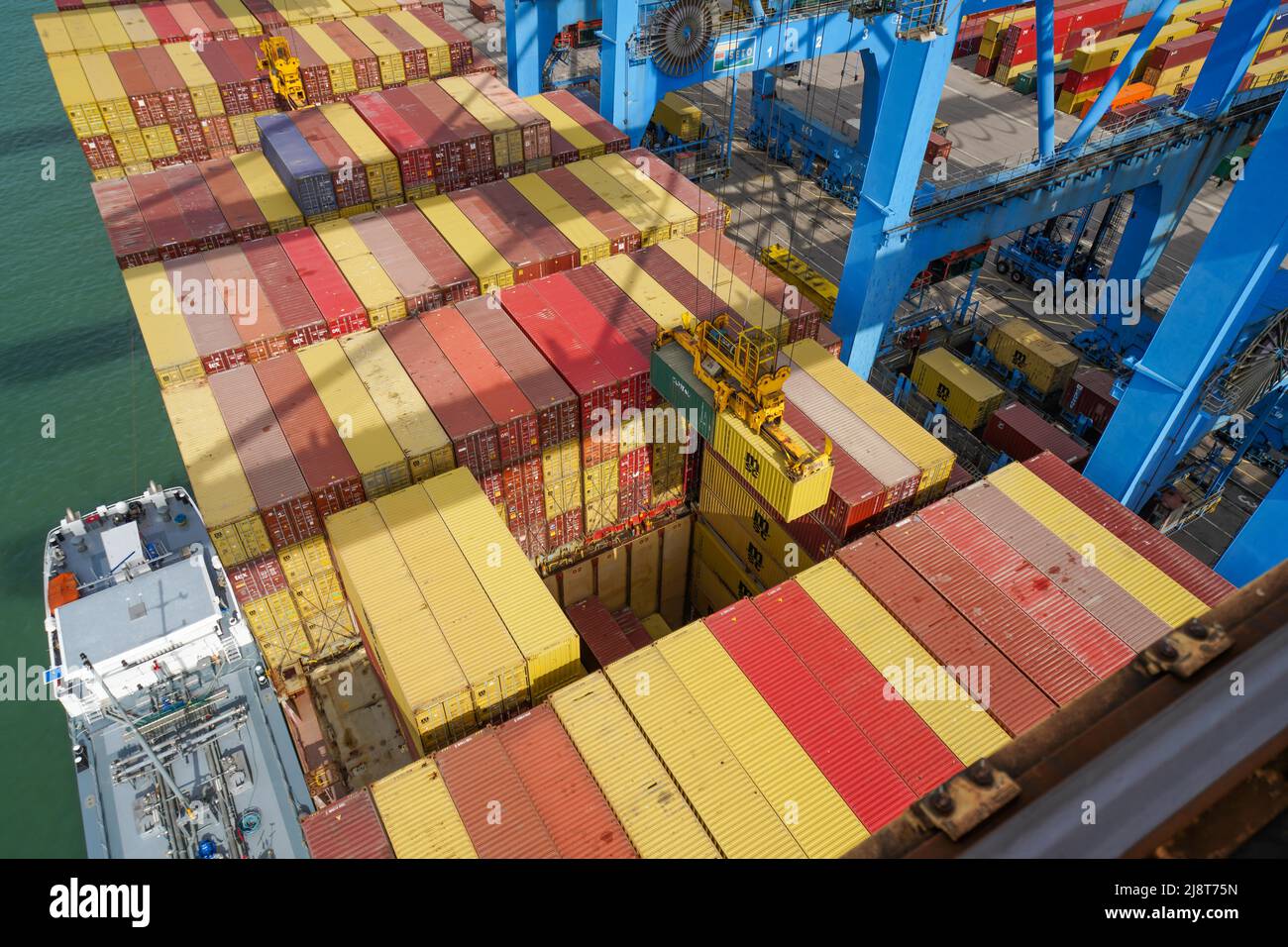 General view of container ship unloading under giant gantries at a terminal in the Haropa port ...
