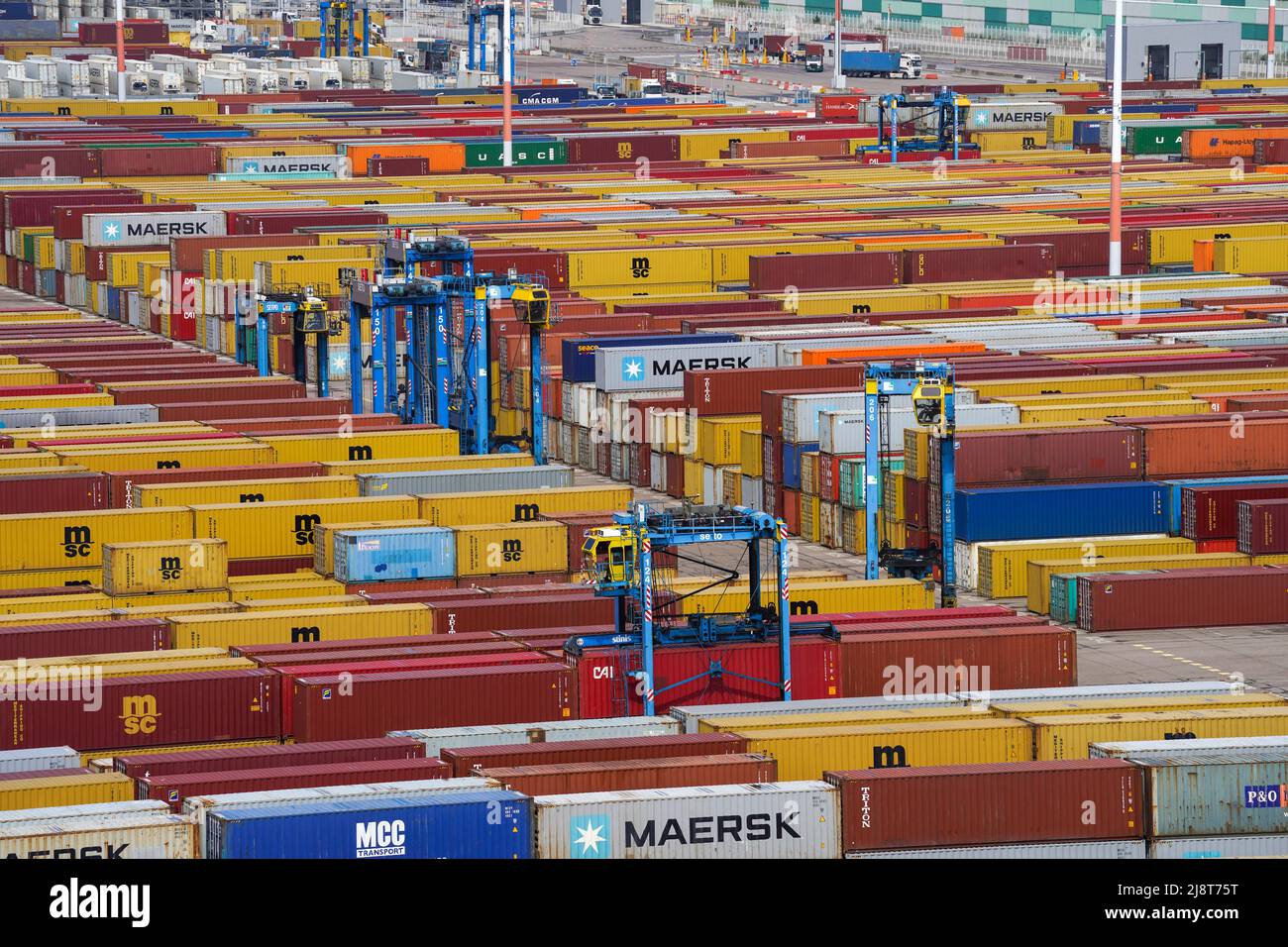 General view of container ship unloading under giant gantries at a terminal in the Haropa port ...