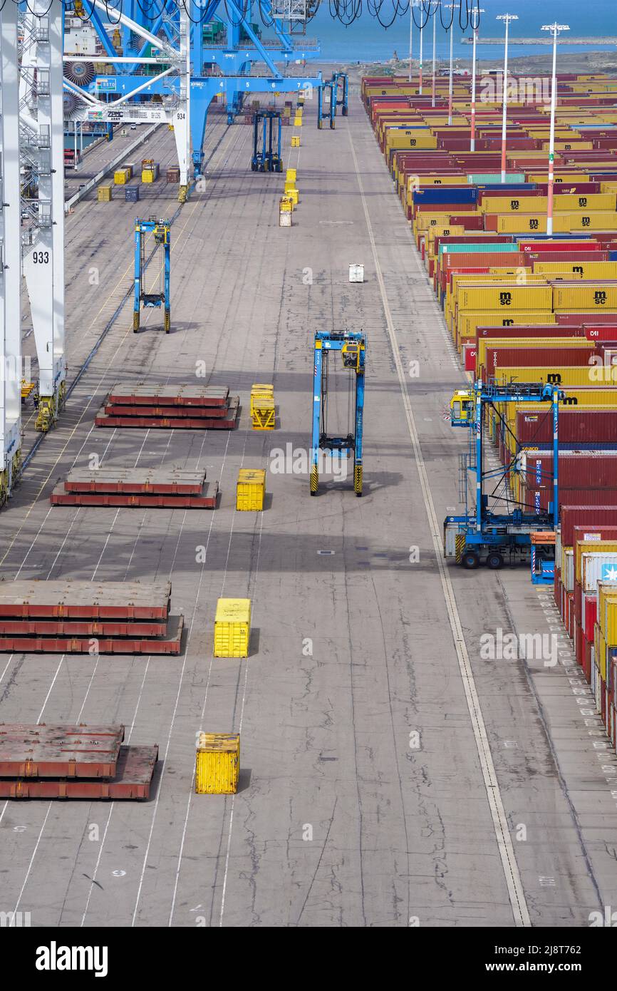 General view of container ship unloading under giant gantries at a ...