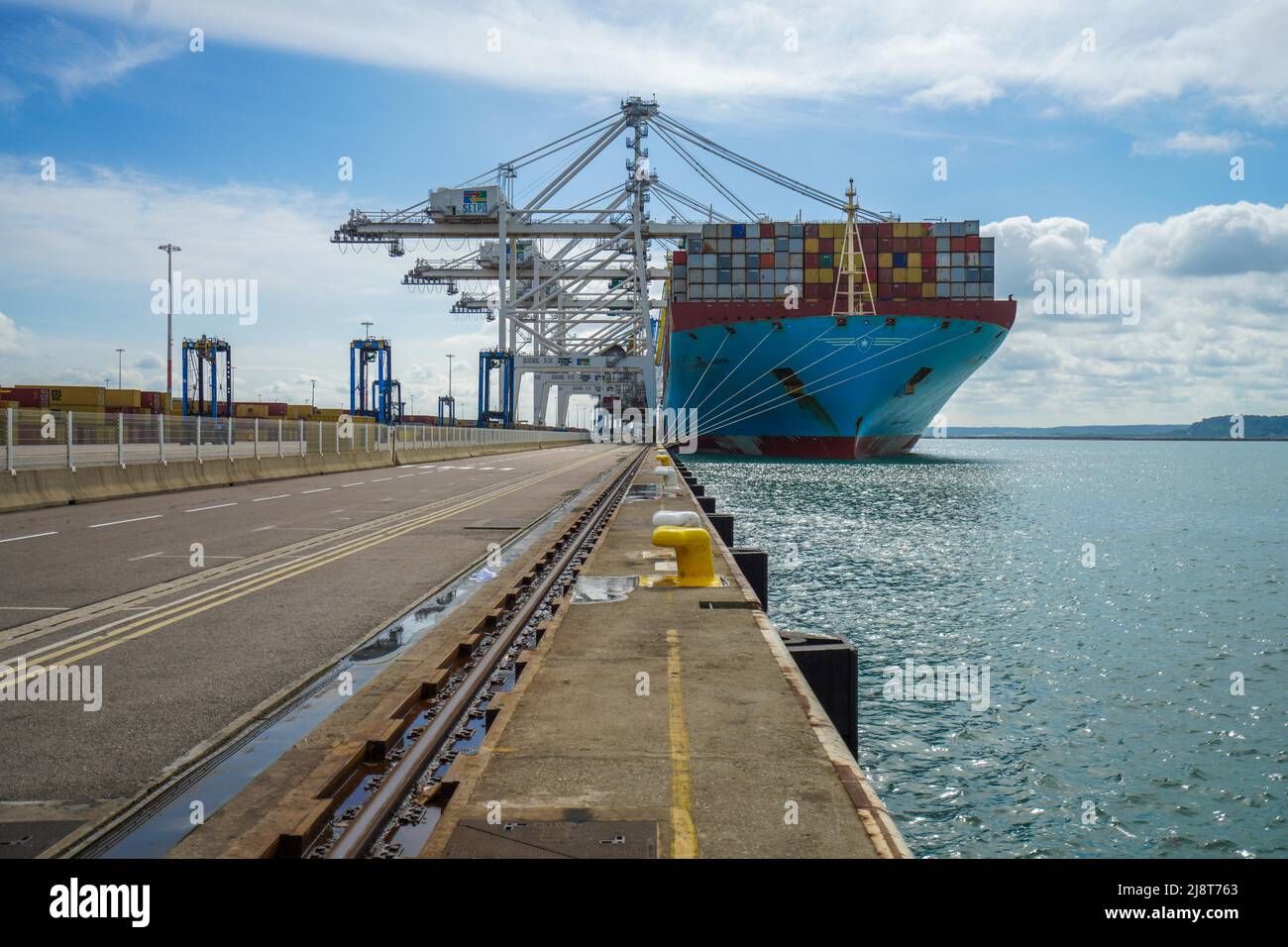General view of container ship unloading under giant gantries at a ...