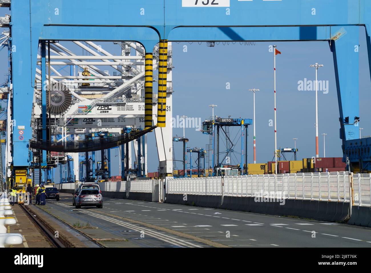 General view of container ship unloading under giant gantries at a ...