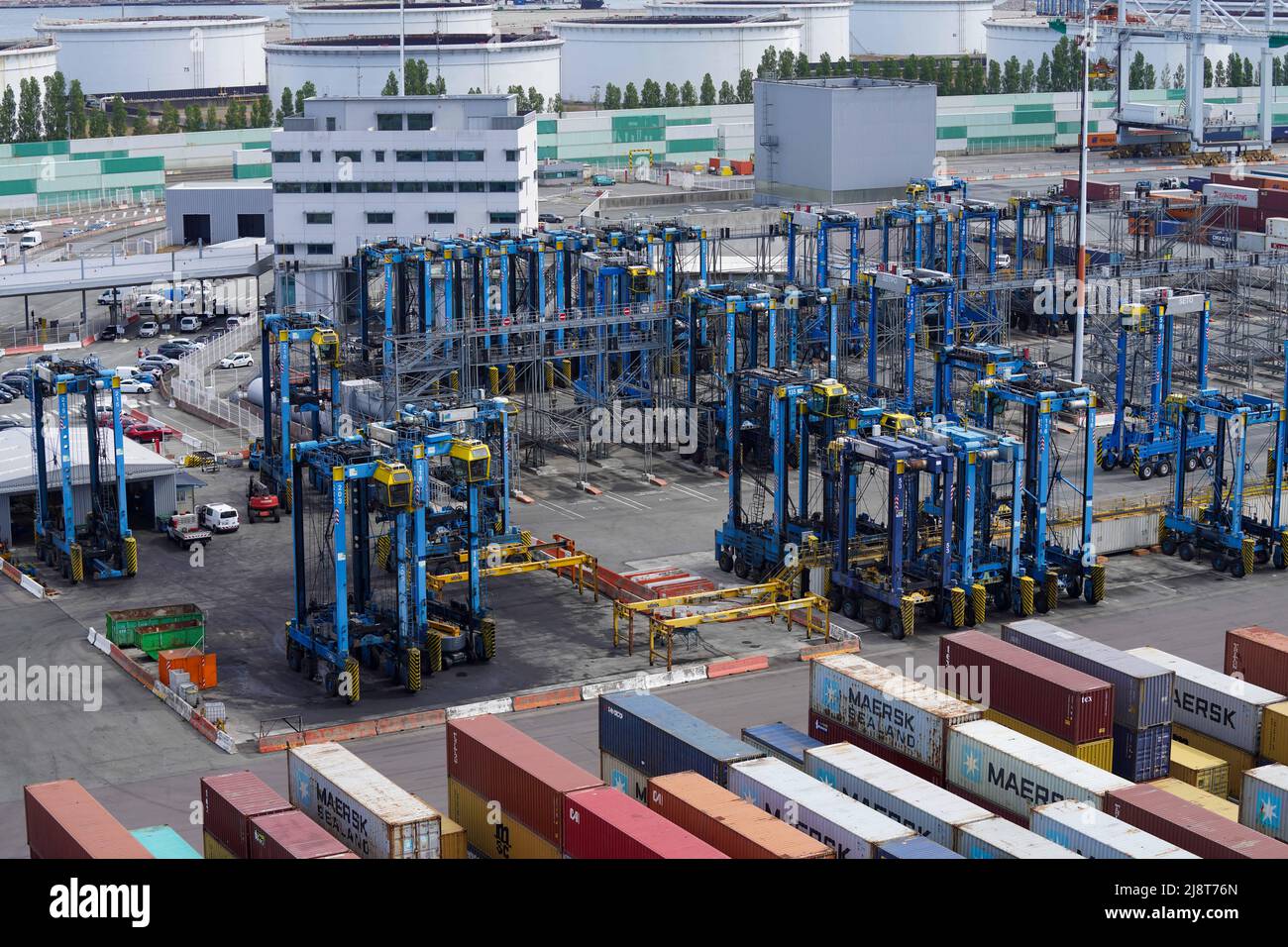 General view of container ship unloading under giant gantries at a ...