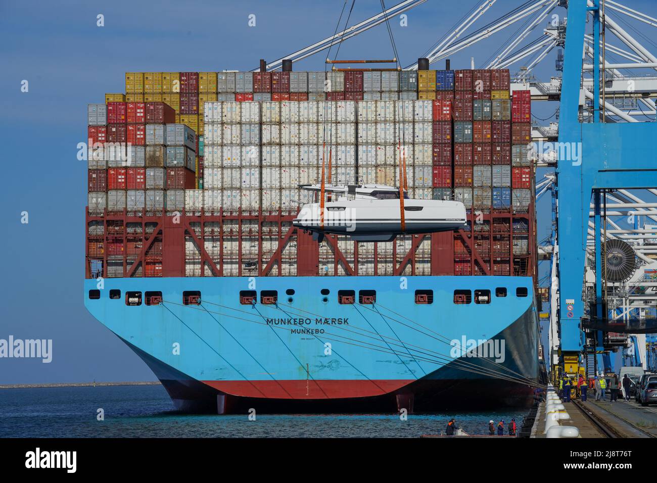 General view of container ship unloading under giant gantries at a ...