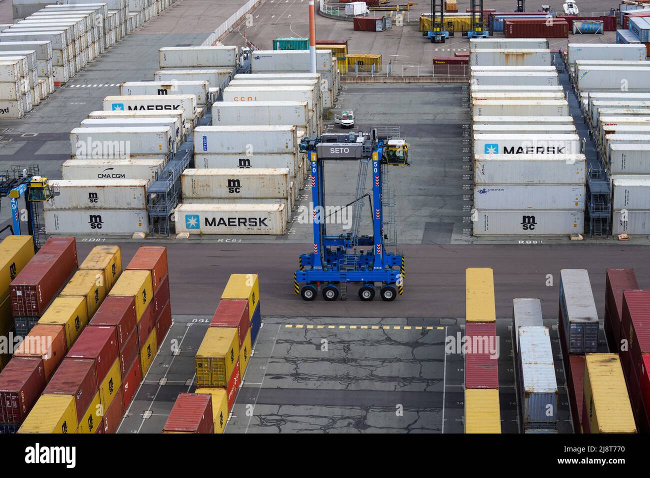 General view of container ship unloading under giant gantries at a ...