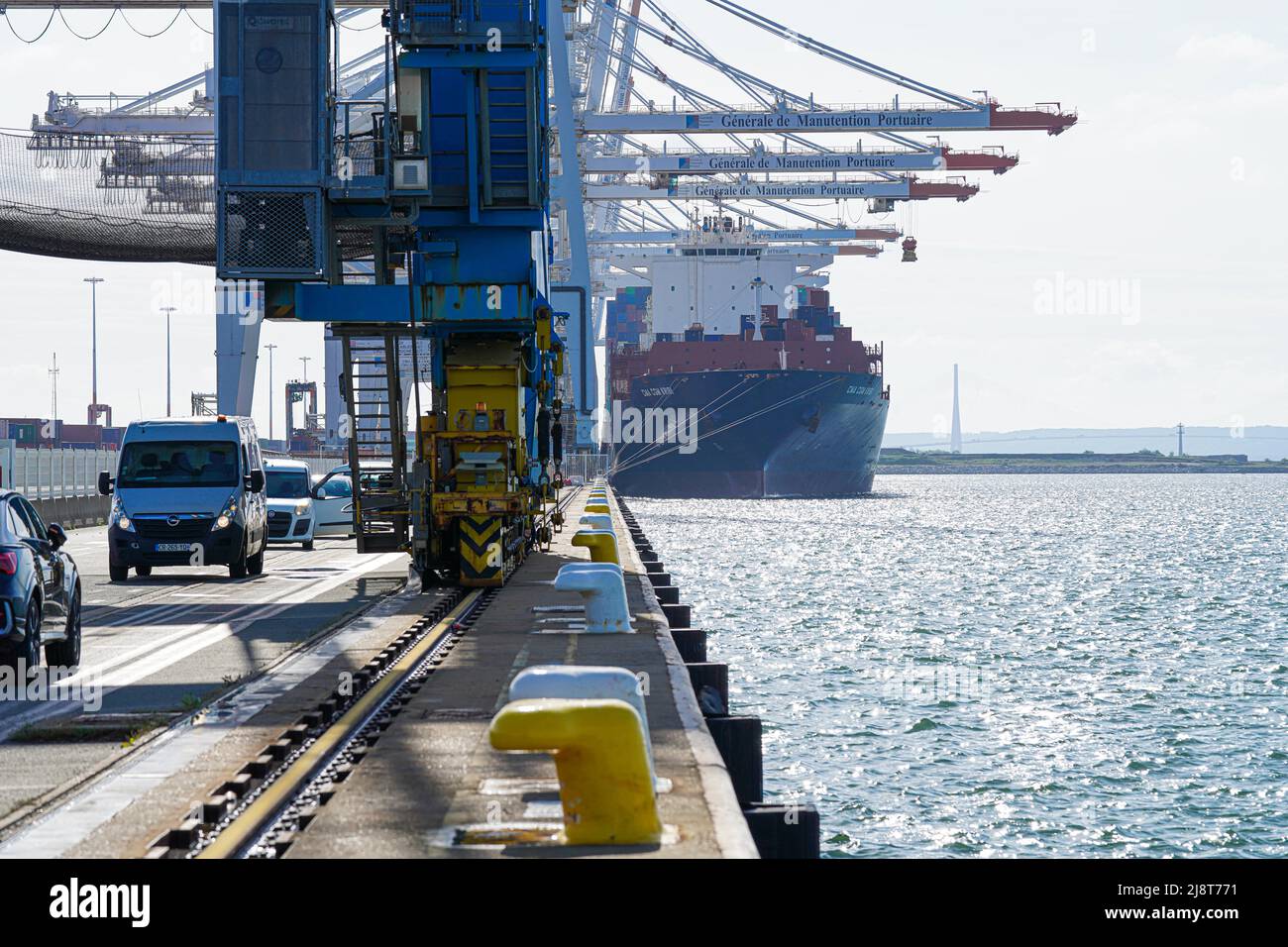 General view of container ship unloading under giant gantries at a ...