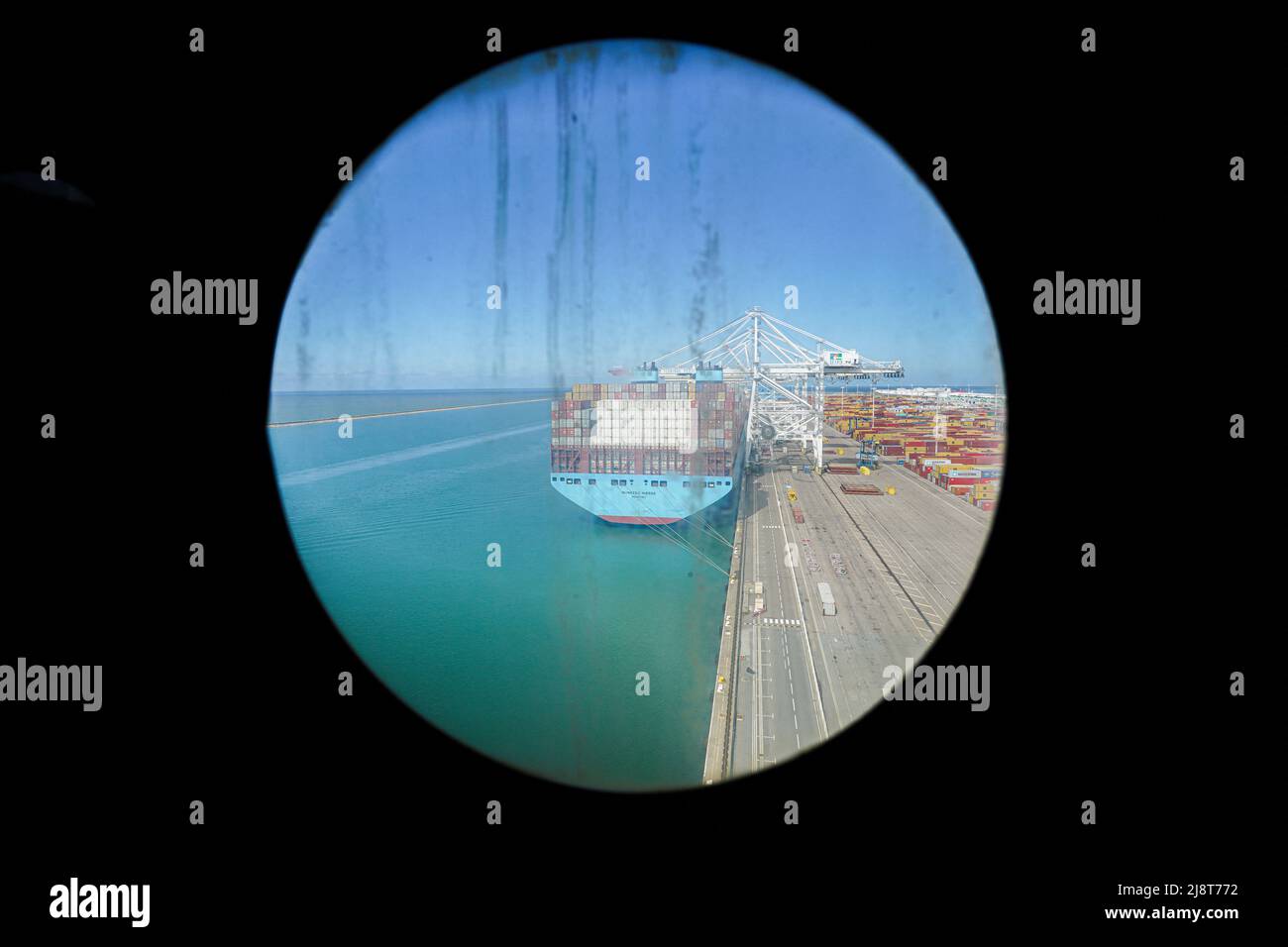 General view of container ship unloading under giant gantries at a ...