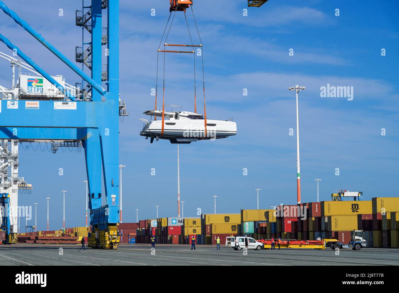 General view of container ship unloading under giant gantries at a ...