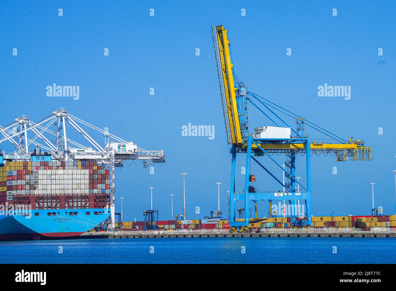 General view of container ship unloading under giant gantries at a ...