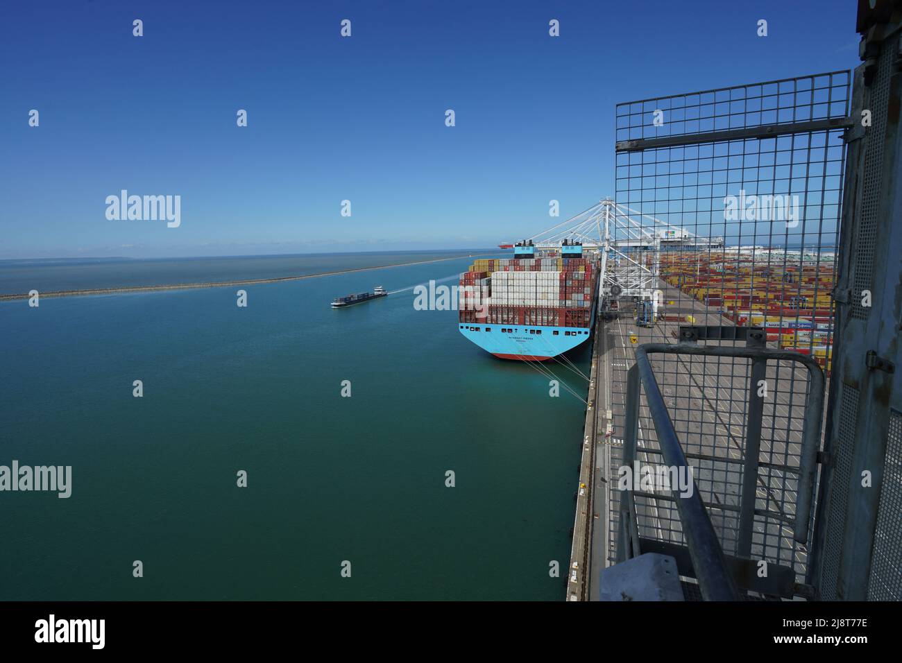 General view of container ship unloading under giant gantries at a ...
