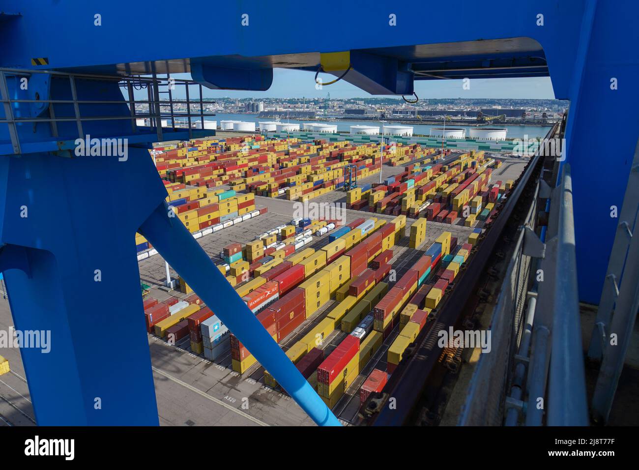 General view of container ship unloading under giant gantries at a terminal in the Haropa port ...