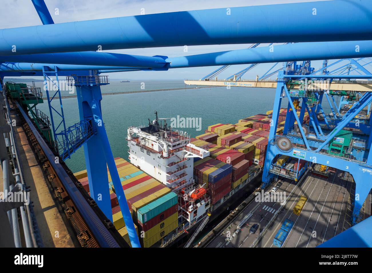 General view of container ship unloading under giant gantries at a ...