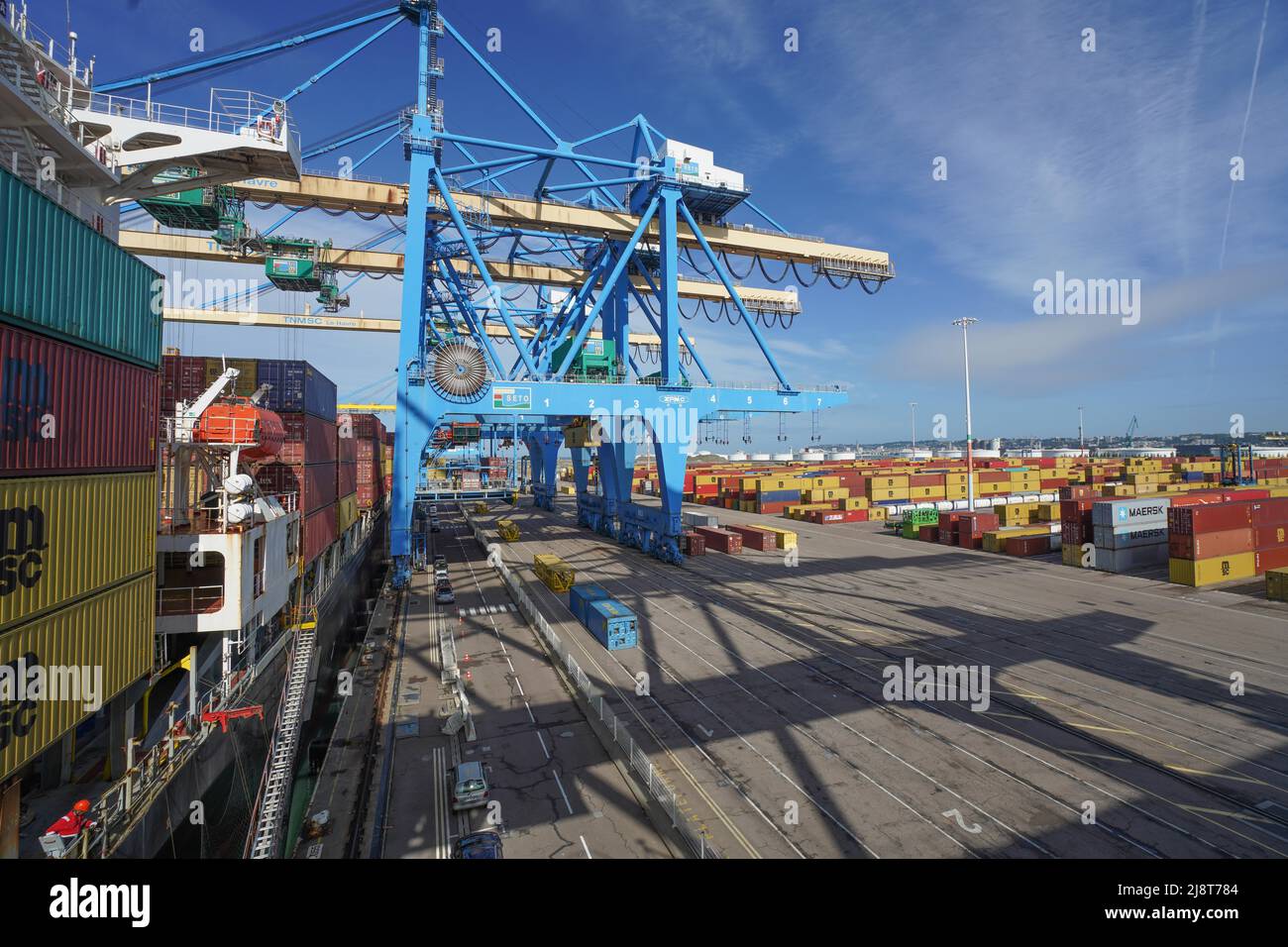 General view of container ship unloading under giant gantries at a ...