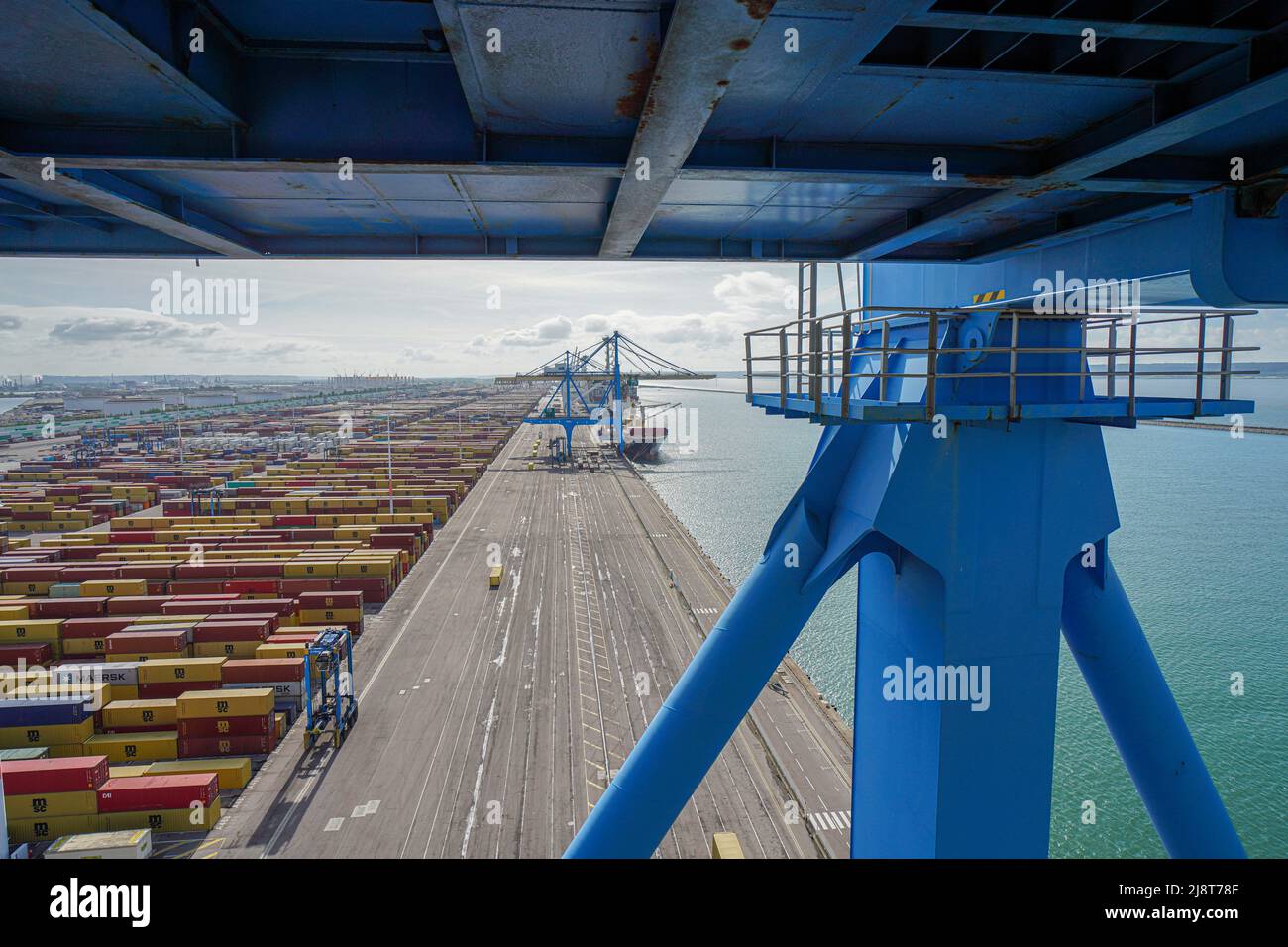 General view of container ship unloading under giant gantries at a ...
