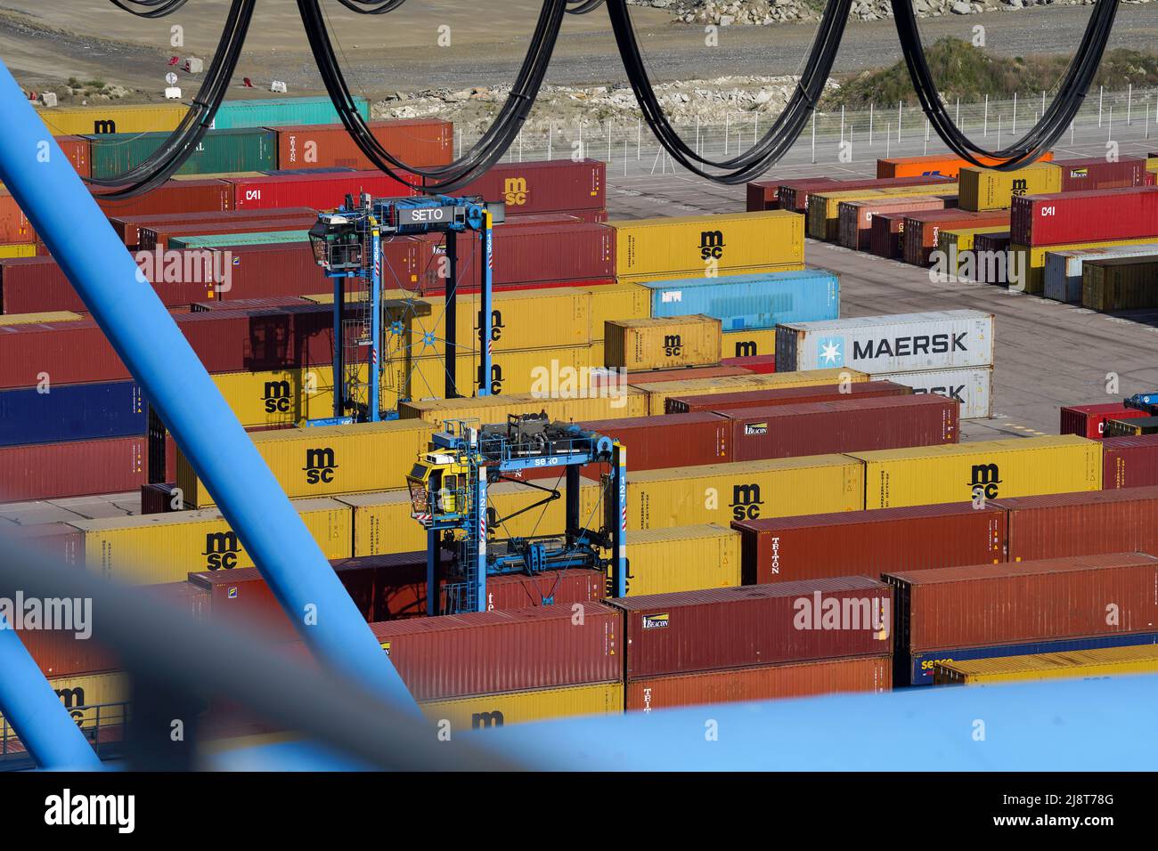 General view of container ship unloading under giant gantries at a terminal in the Haropa port ...