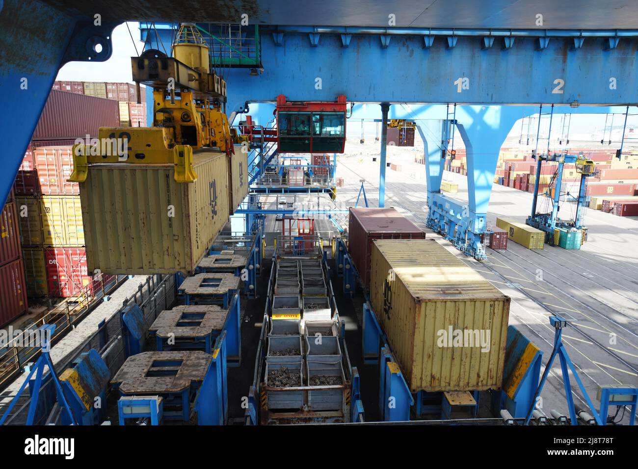 General view of container ship unloading under giant gantries at a ...