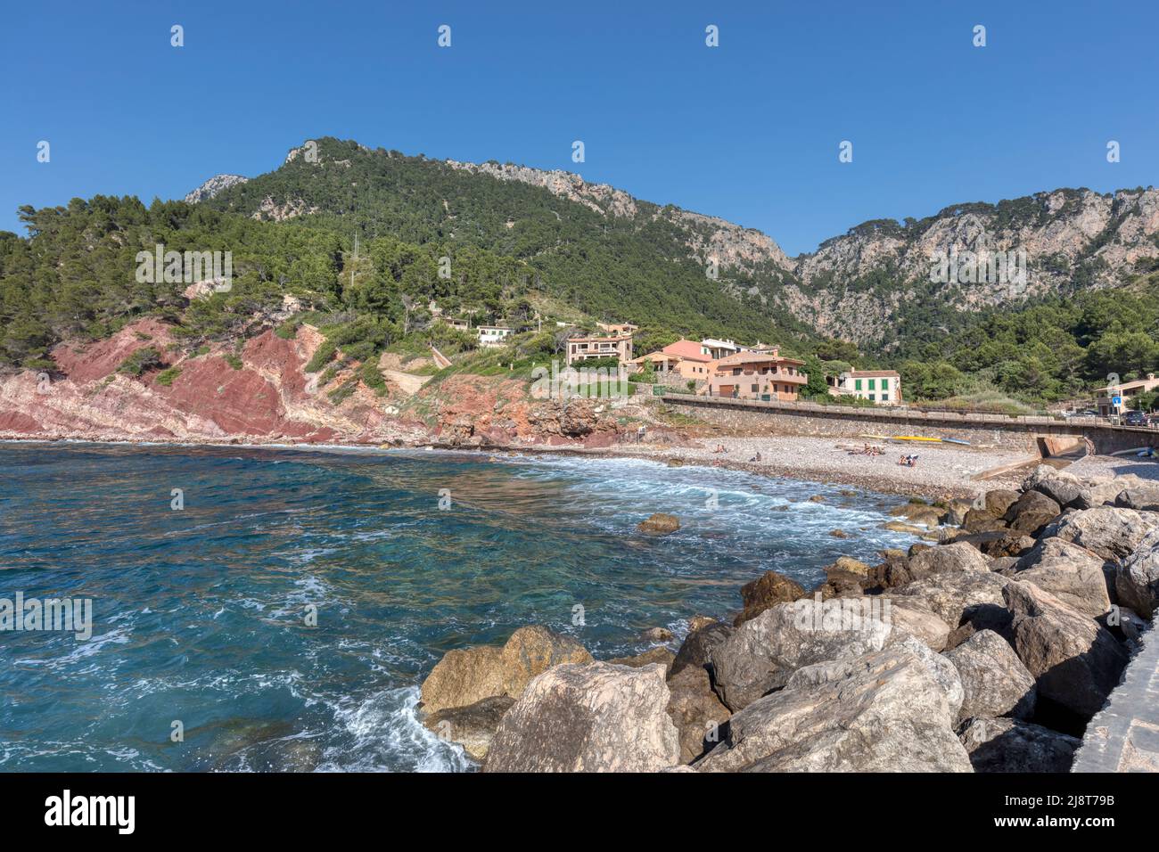 Beach at Port de Valldemossa in rocky UNESCO world heritage Serra de ...